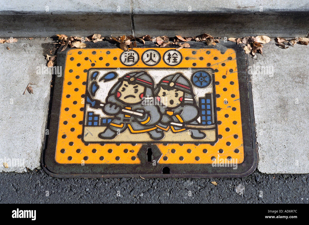 Decorated plate covering a fire hydrant from the Tokyo Fire Department ...