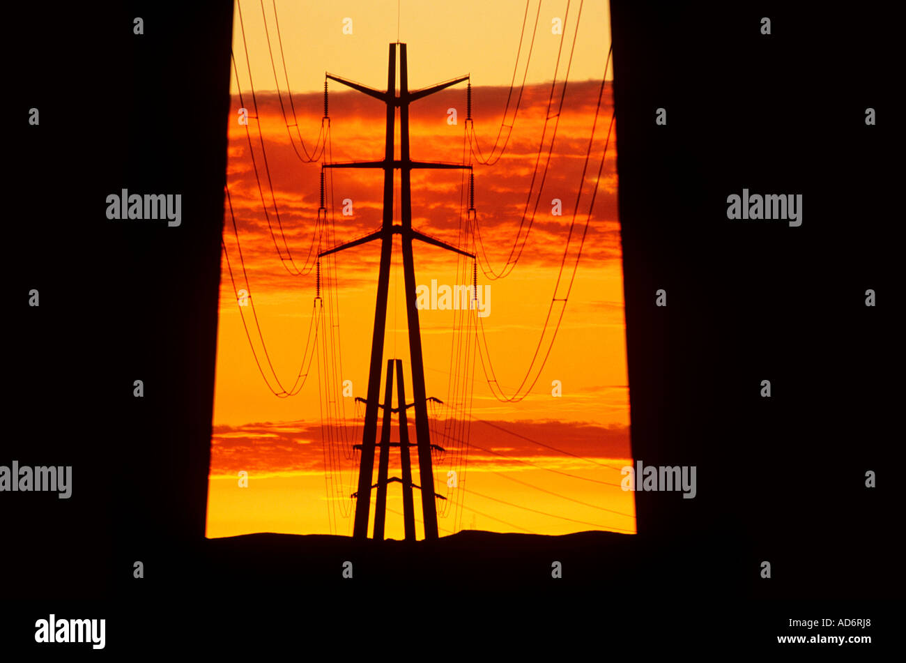 Powerlines stretch over southern california in the sunset power poles ...