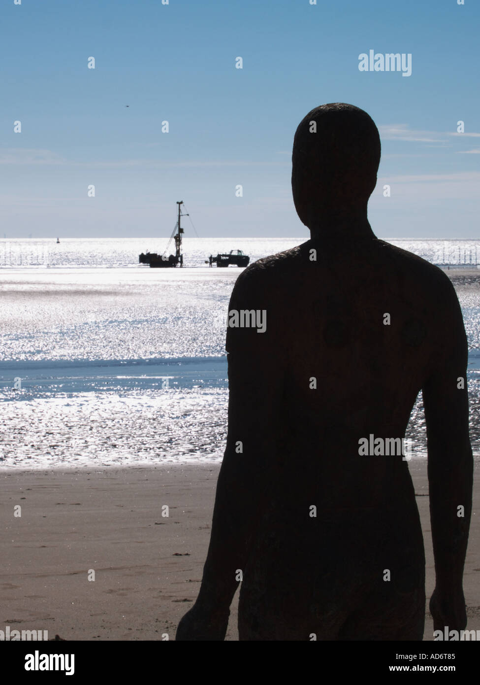 Antony Gormley statue at Crosby beach Stock Photo - Alamy