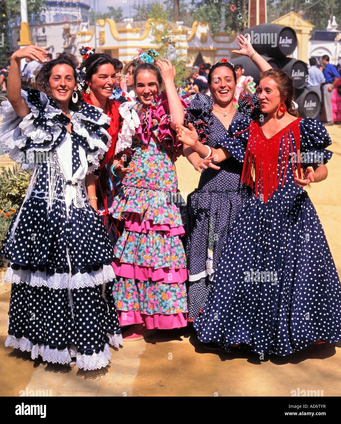 Jerez Horse Fair, Feria del Caballo, joyful young woman dressed in trajes de gitanas (gypsy ...