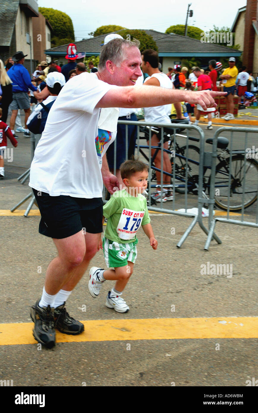 Parents and children run together in 5K race before start of 4th of ...