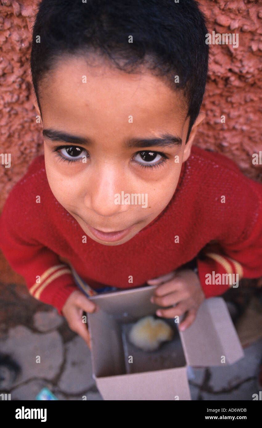 Morocco Marrakesh Portrait of a boy with a baby chick Stock Photo - Alamy