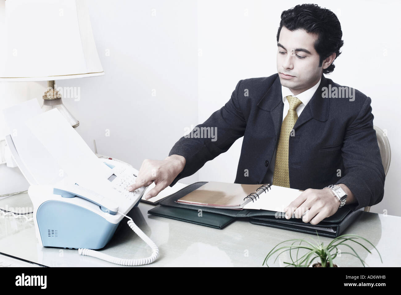 Businessman using fax machine hi-res stock photography and images - Alamy