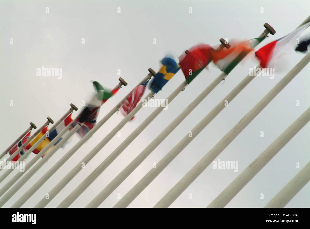 A row of international flags flying in the wind on Plymouth Hoe Devon ...