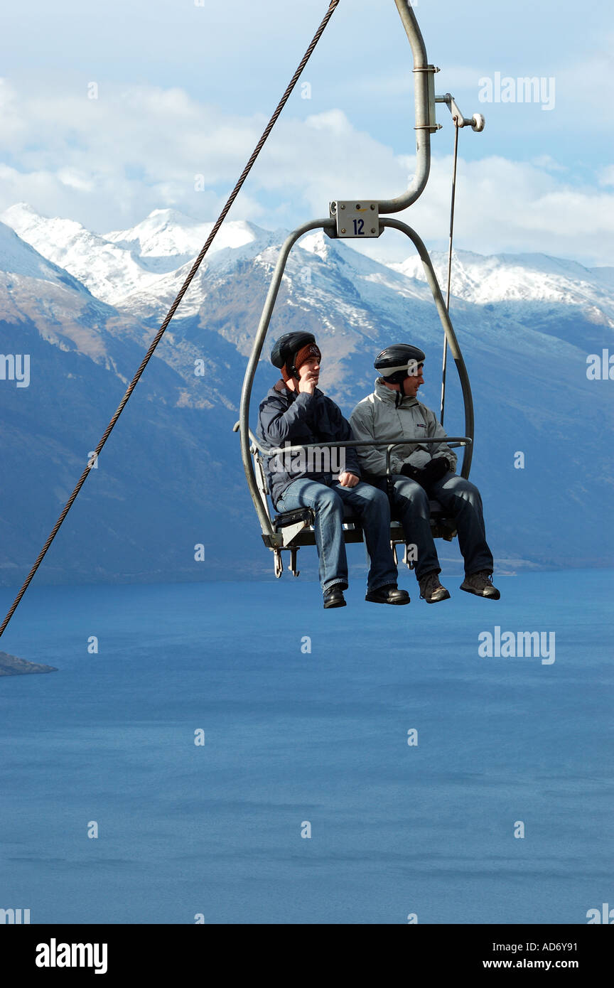 Two people on a chair lift Stock Photo - Alamy