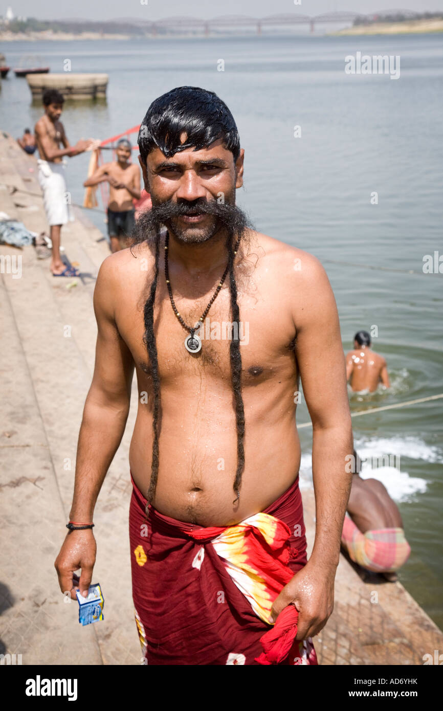 An Indian man with long moustache on the banks of the Ganges. Varanasi ...