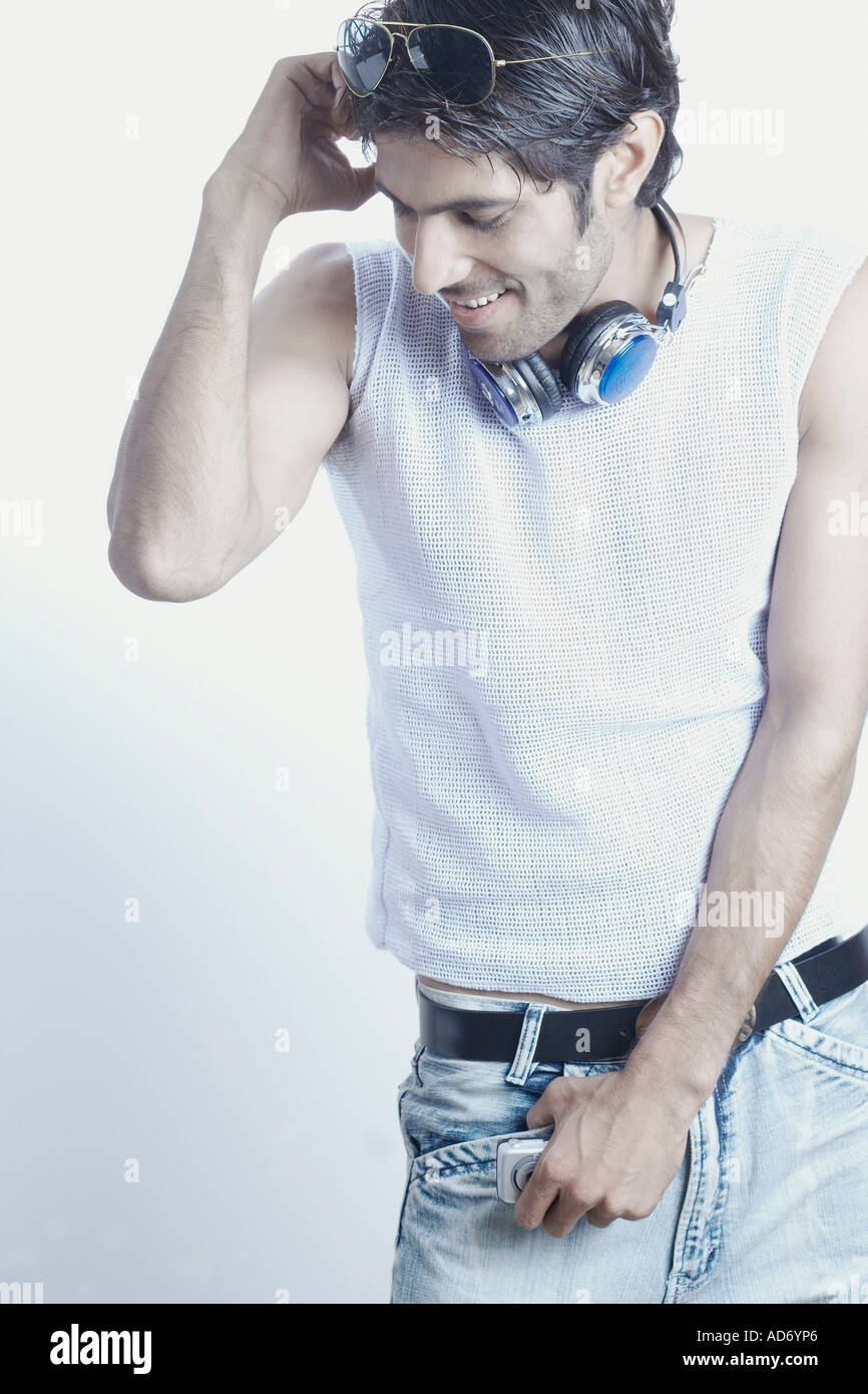 Young man looking down smiling Stock Photo - Alamy