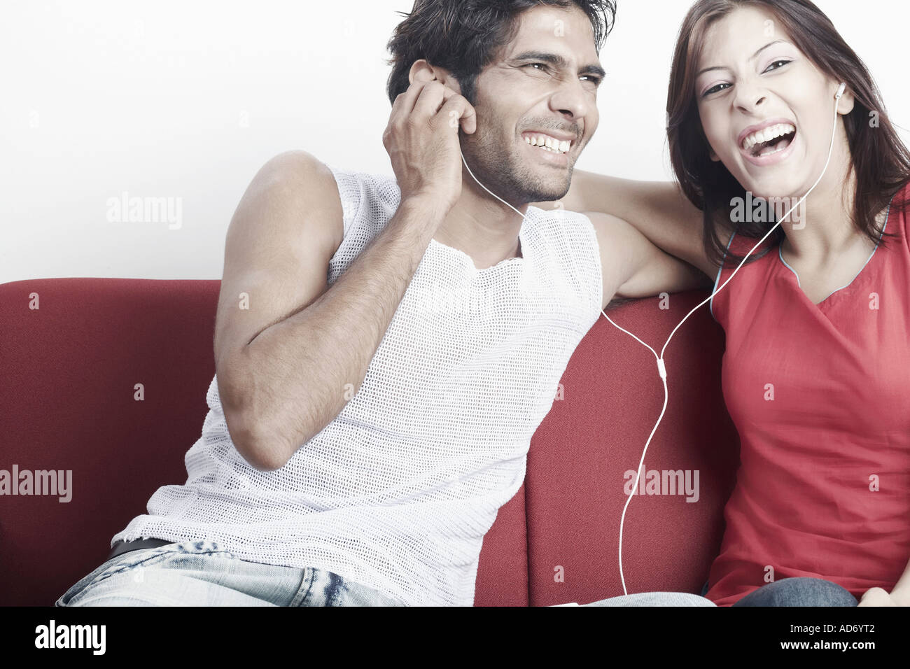 Young indian couple headphones hi-res stock photography and images - Alamy