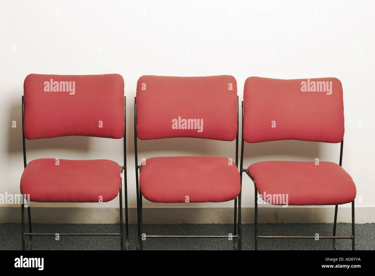 Three chairs in a row Stock Photo - Alamy