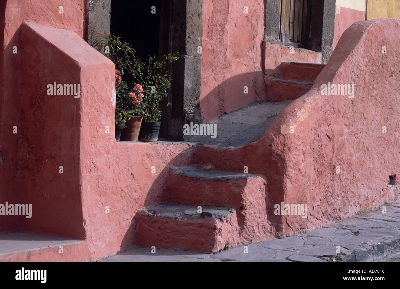 Red shop front and steps San Miquel de Allende Mexico Stock Photo - Alamy