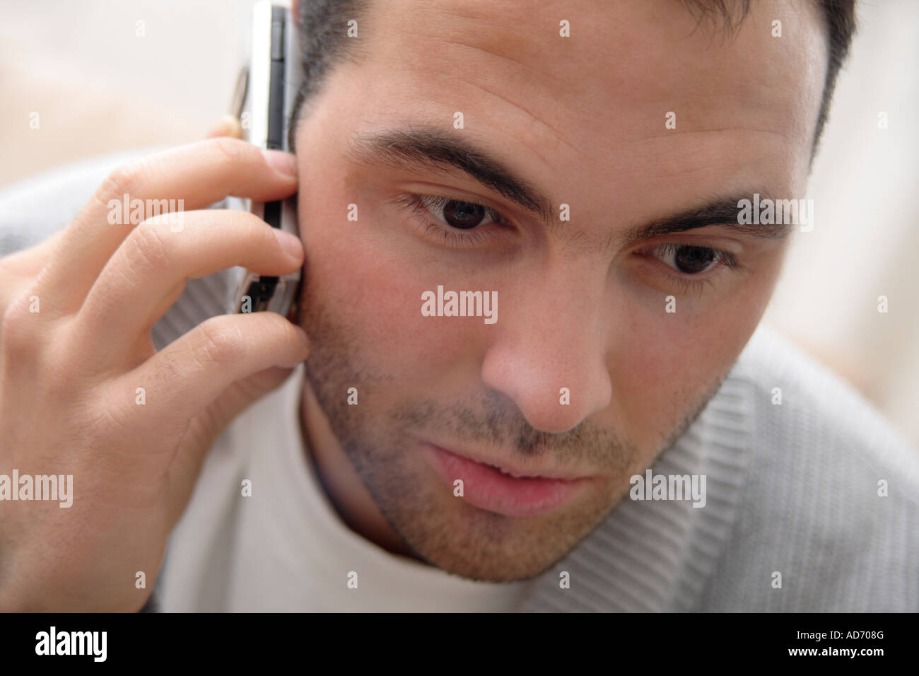 Young man using cell phone, portrait Stock Photo - Alamy