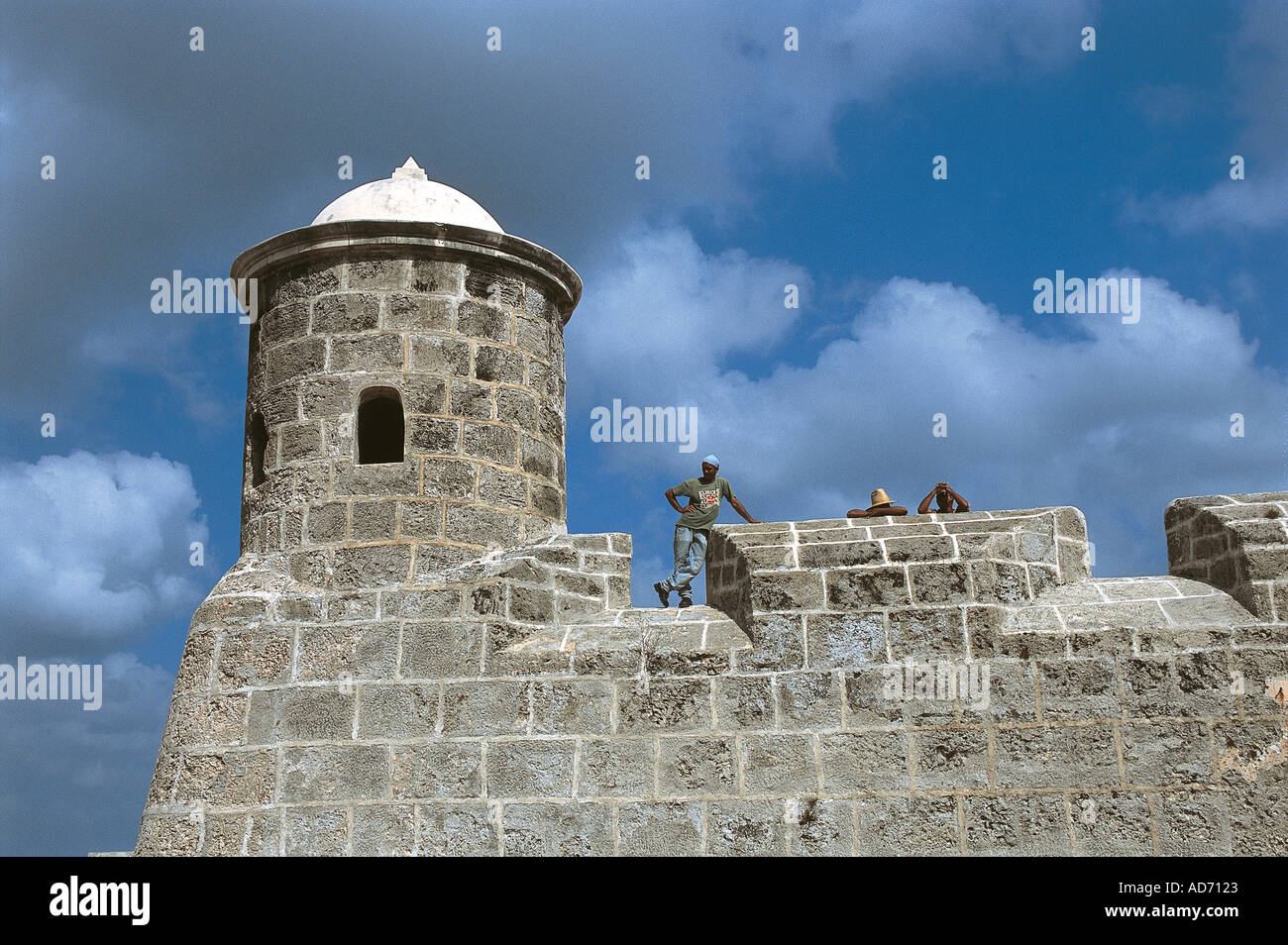 Cuba Havana workers resting on the parapet of the fortress La Punta ...