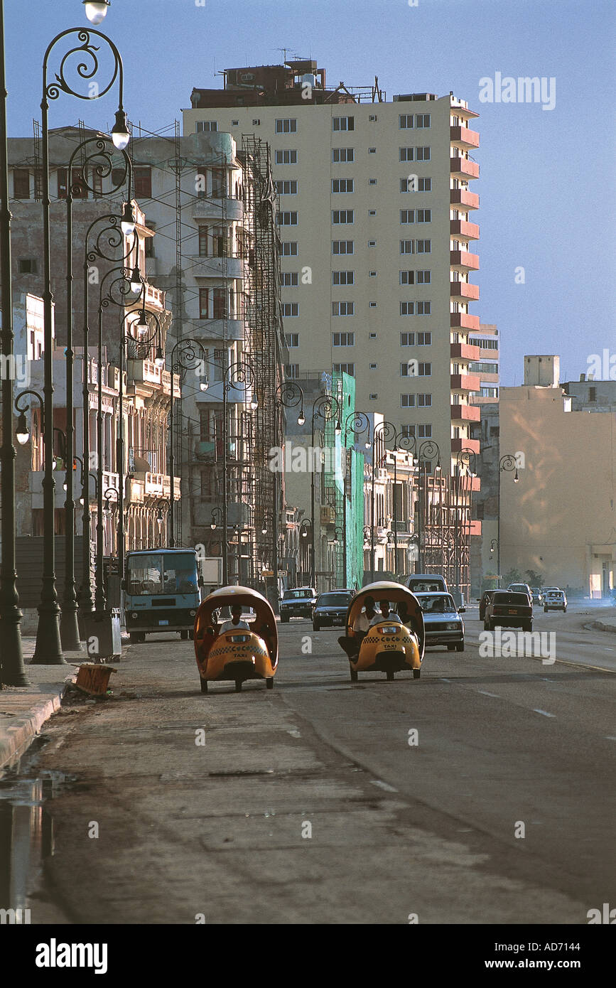 Cuba Havana coco taxis along seafront El Malecon Stock Photo - Alamy