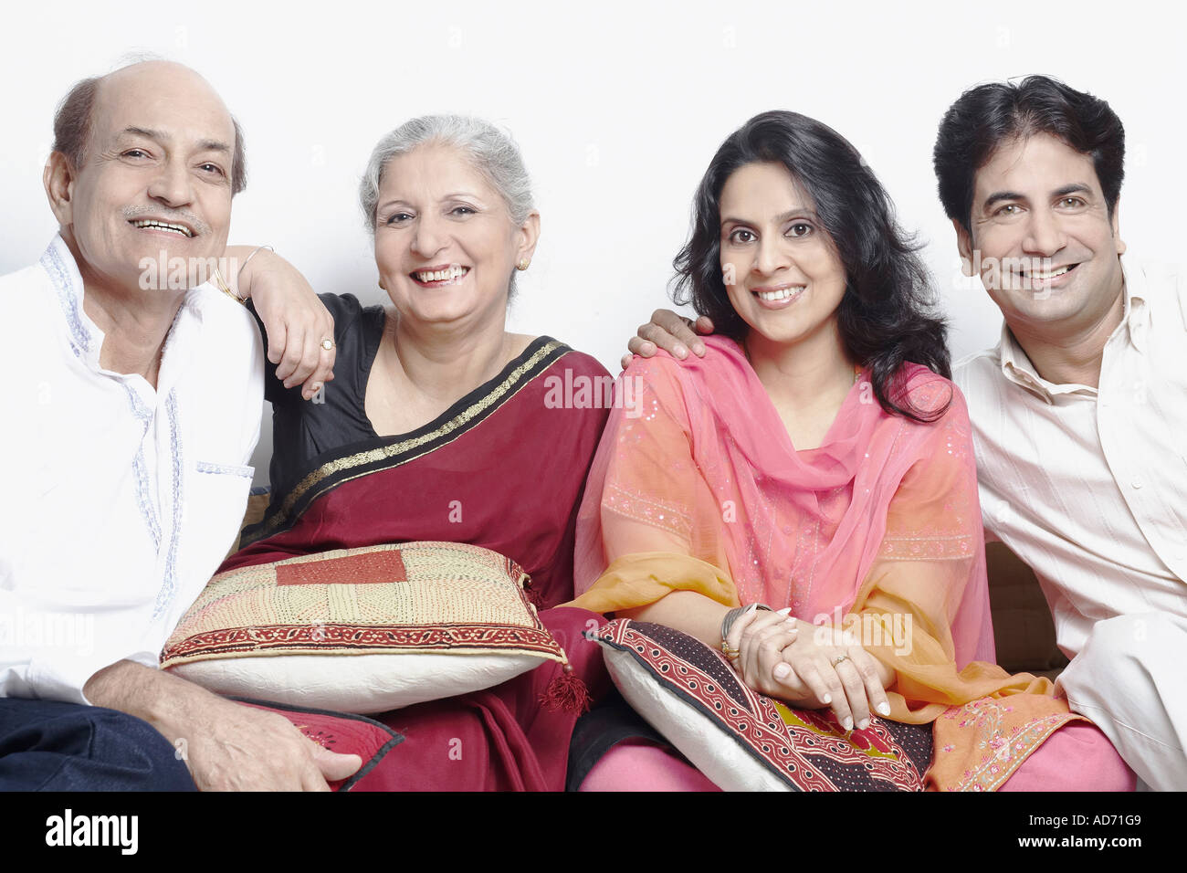 Portrait of four people smiling Stock Photo - Alamy