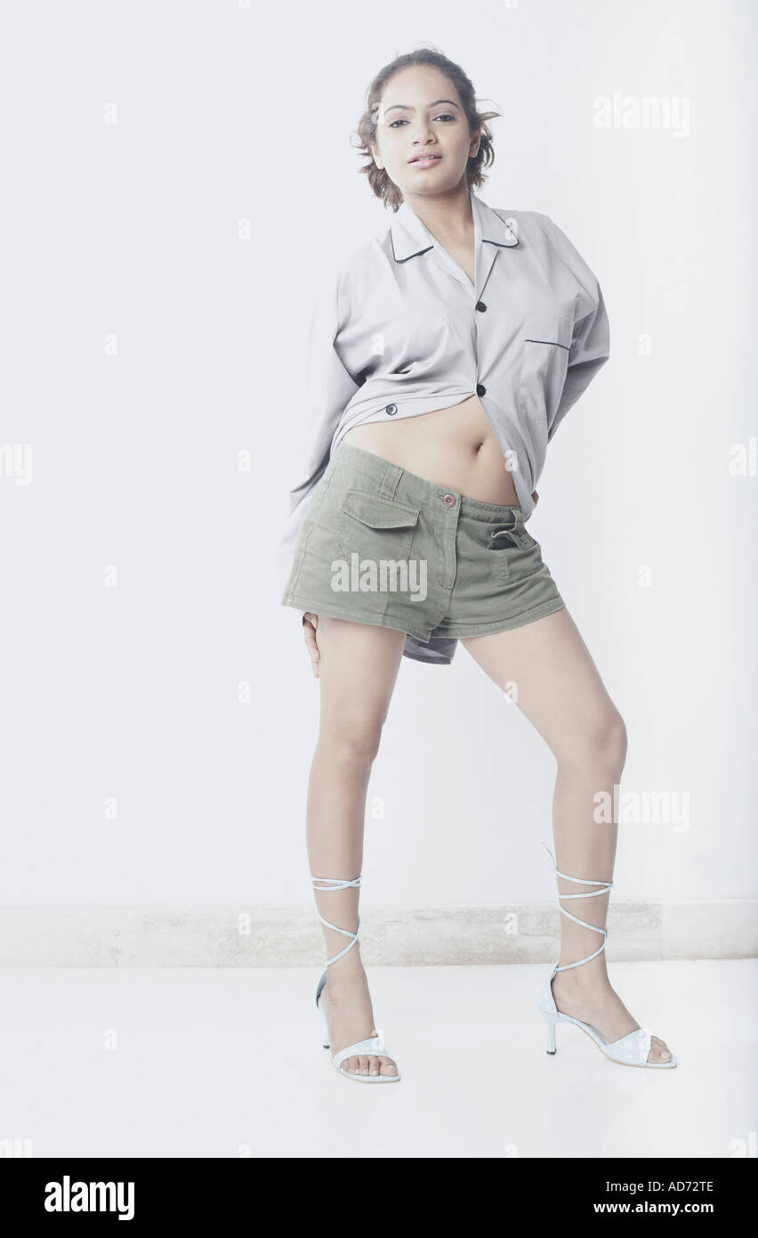 Portrait of a young woman with his hand behind his back Stock Photo - Alamy