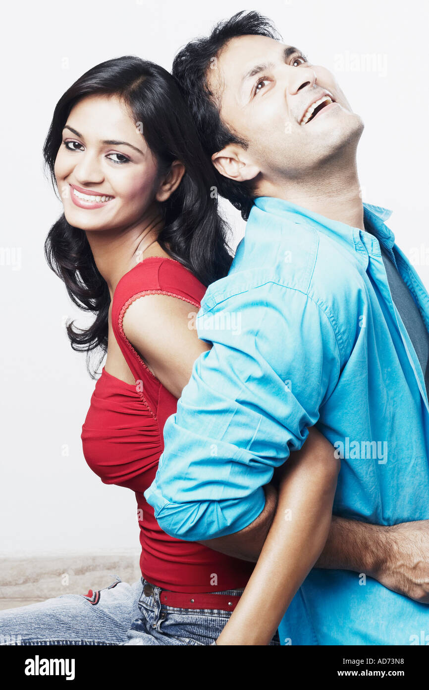 Couple sitting intertwined hi-res stock photography and images - Alamy