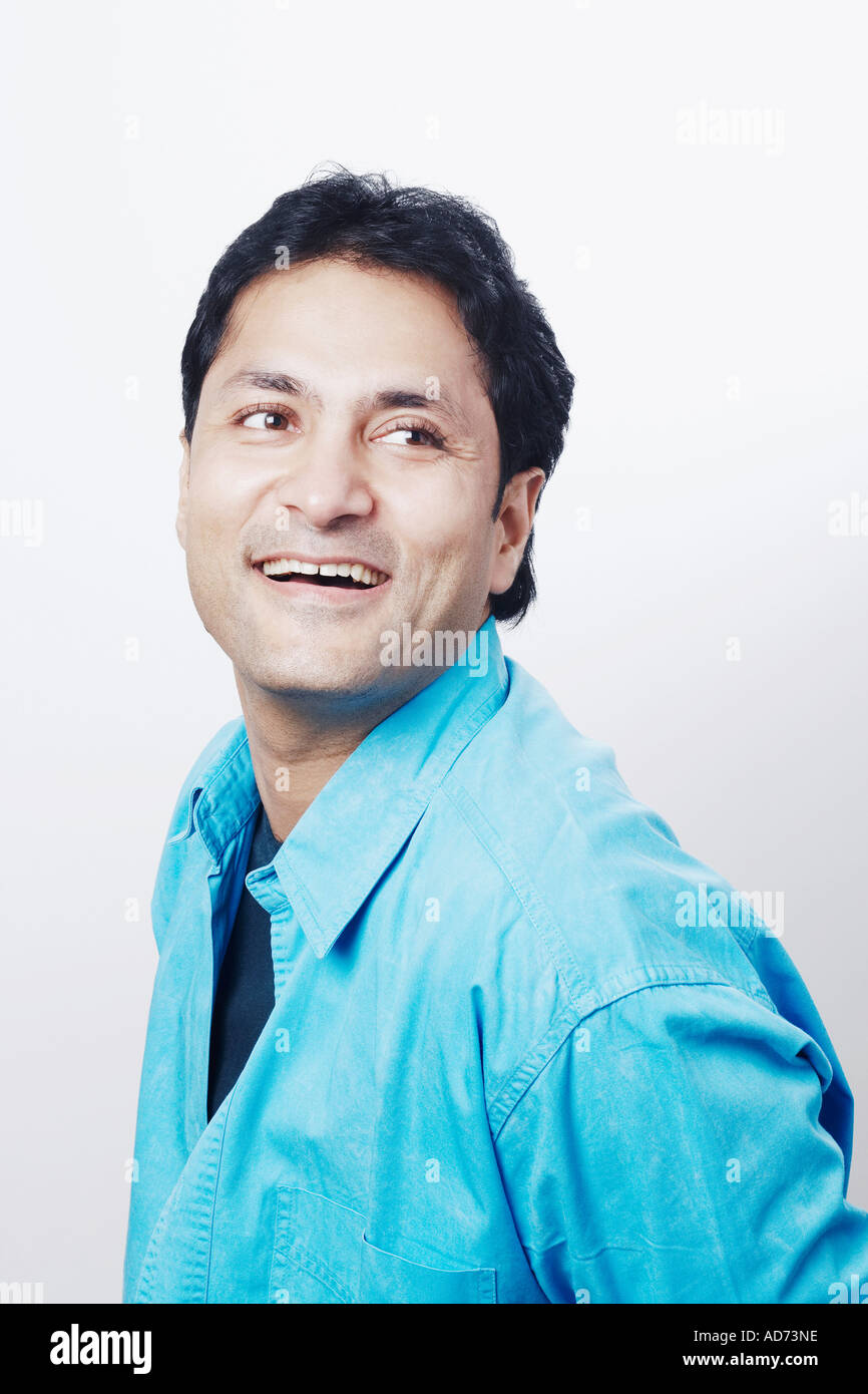 Side profile of a young man smiling Stock Photo - Alamy