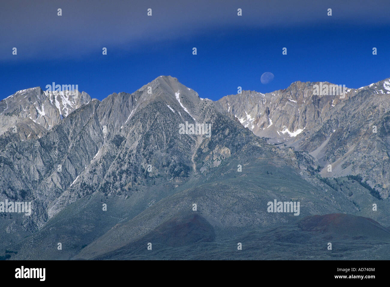Moon sets over the crest of the Eastern Sierra near Independence Inyo ...