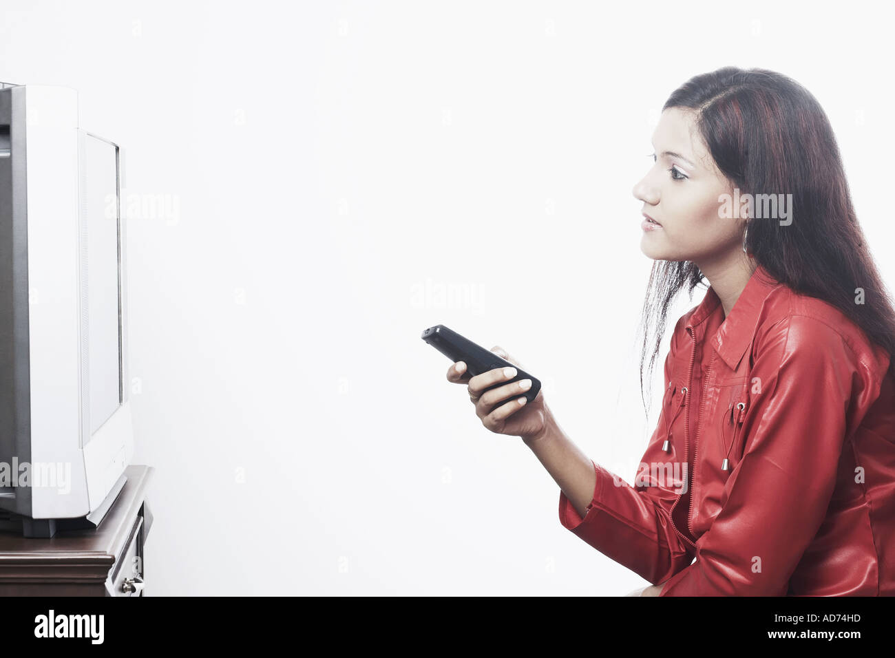 Side profile of a young woman watching television Stock Photo - Alamy