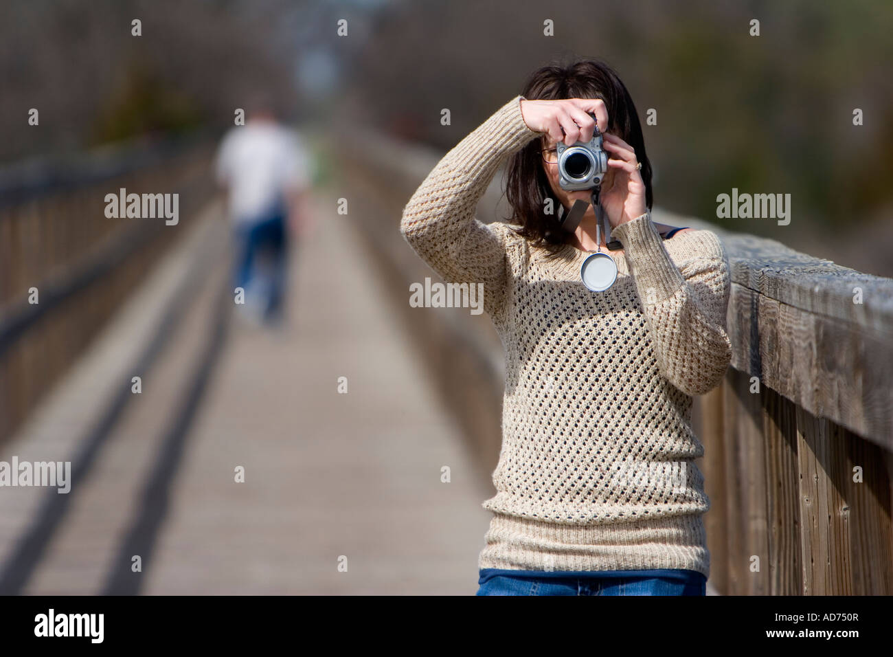 A photographer takes a photo in the direction of the camera Stock Photo ...