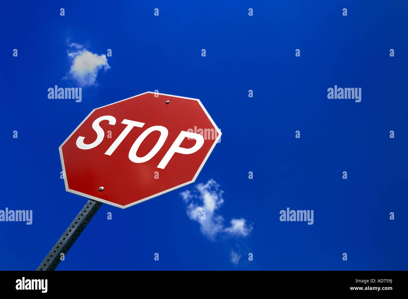 american usa stop sign against blue sky Stock Photo - Alamy