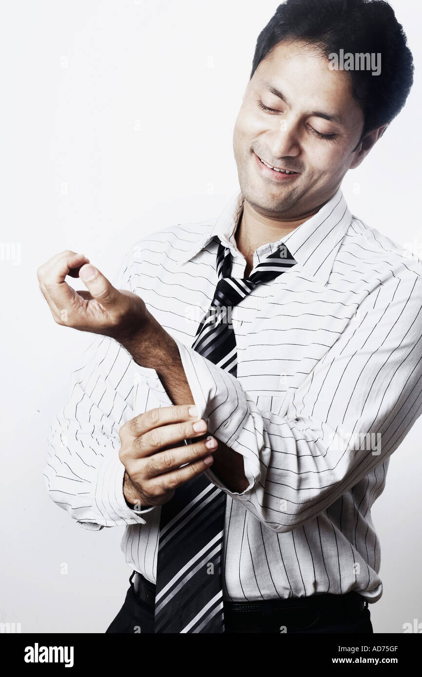 Buttoning cuff hi-res stock photography and images - Alamy