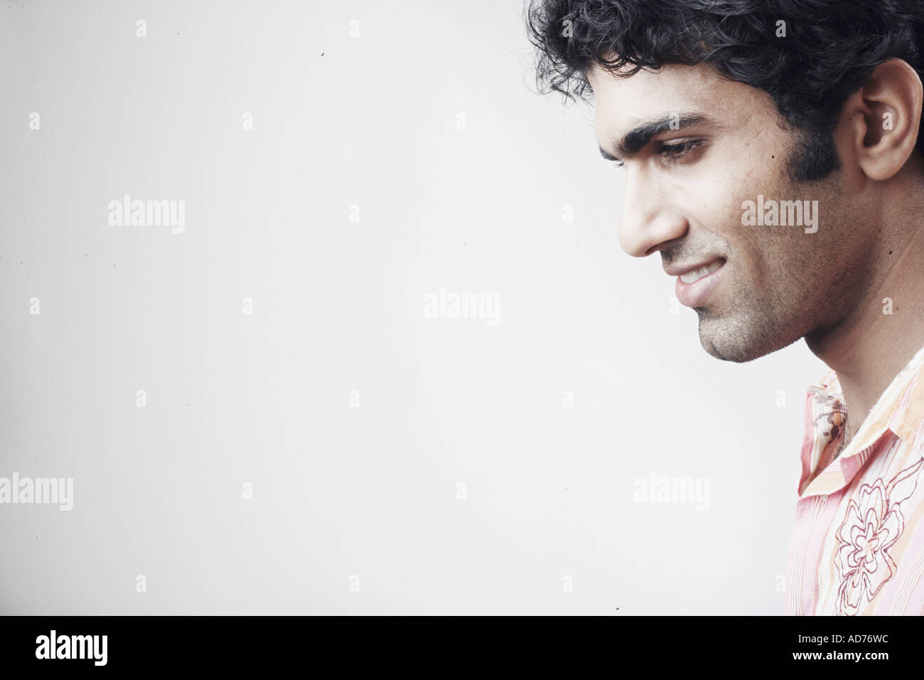 Side profile of a young man smiling Stock Photo - Alamy