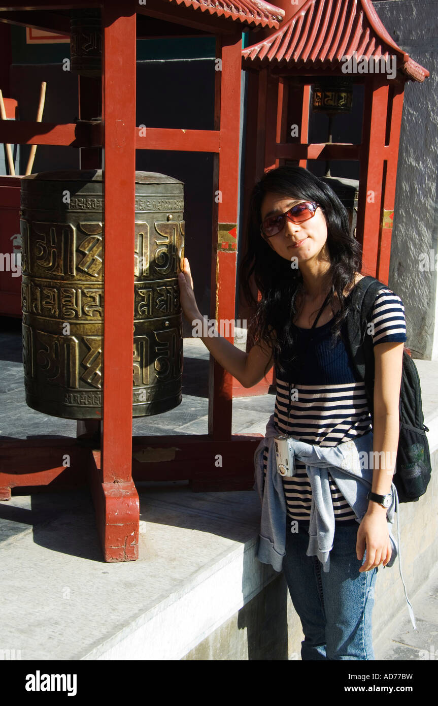 Tibetan women spinning prayer wheel hi-res stock photography and images ...