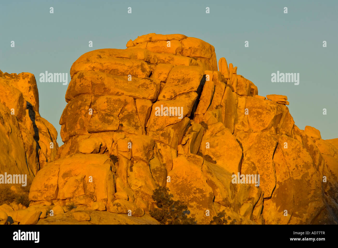 Boulder rock outcrop at sunrise Hidden Valley Joshua Tree National Park ...