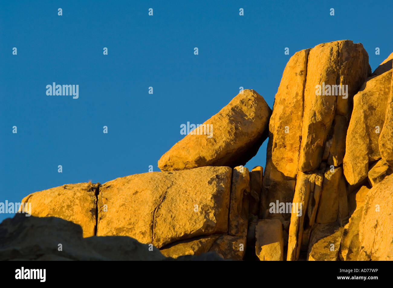 Boulder rock outcrop at sunrise Hidden Valley Joshua Tree National Park ...