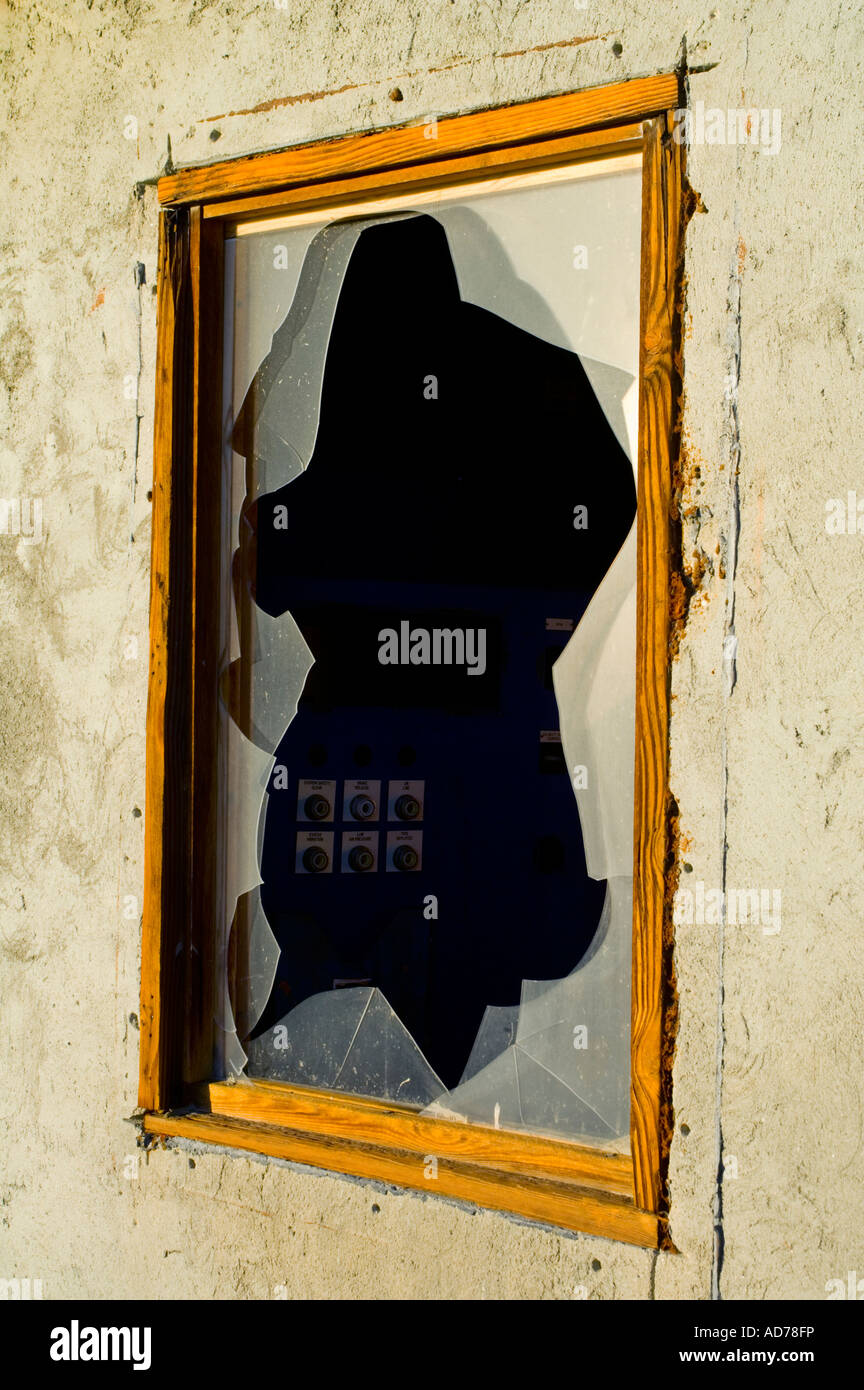 Broken glass window in maintanence shed wall Palm Springs California ...
