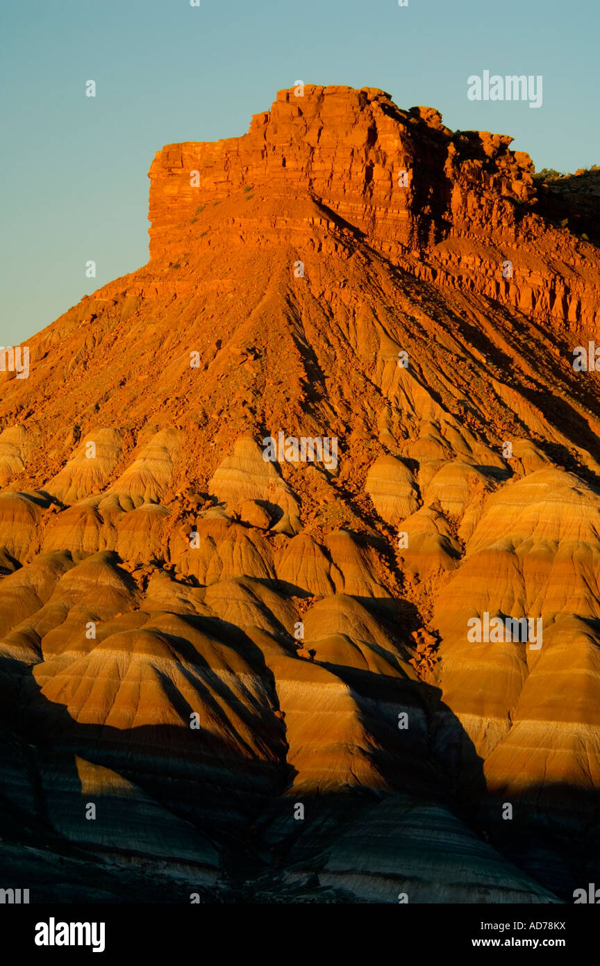 Sunset light on eroded hills and buttes along the Cockscomb Grand ...