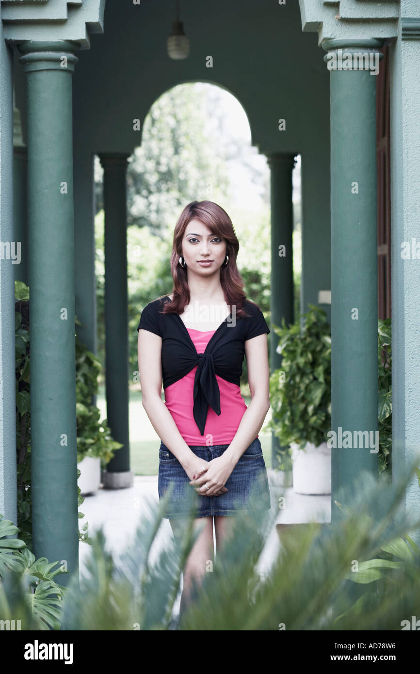 Woman standing by a column woman standing by a column hi-res stock ...