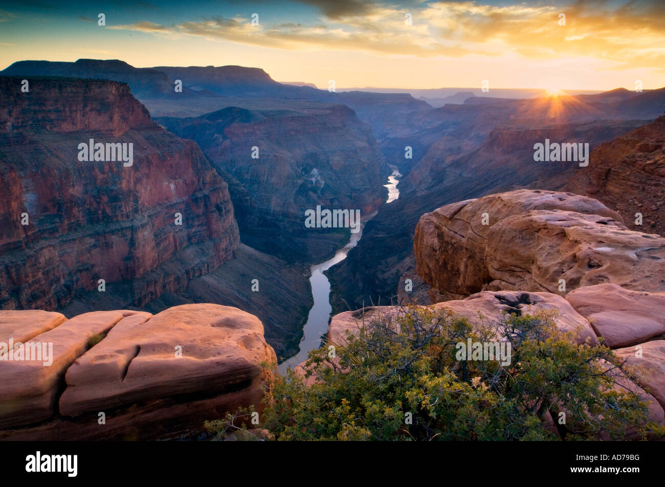 Steep rugged cliffs above the Colorado River at sunset Toroweap Grand ...