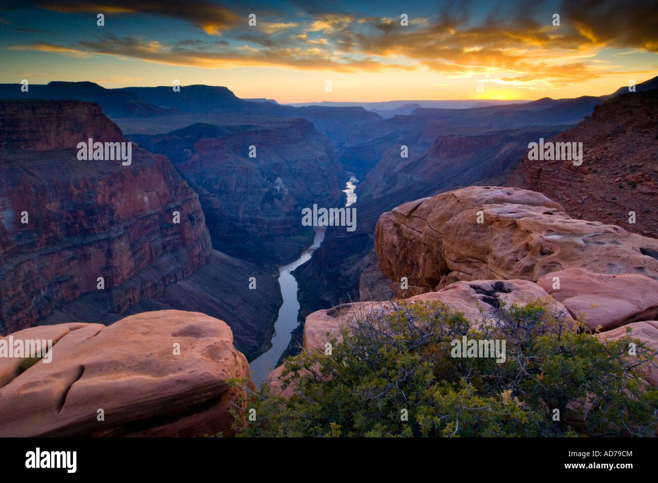 Steep rugged cliffs above the Colorado River at sunset Toroweap Grand ...