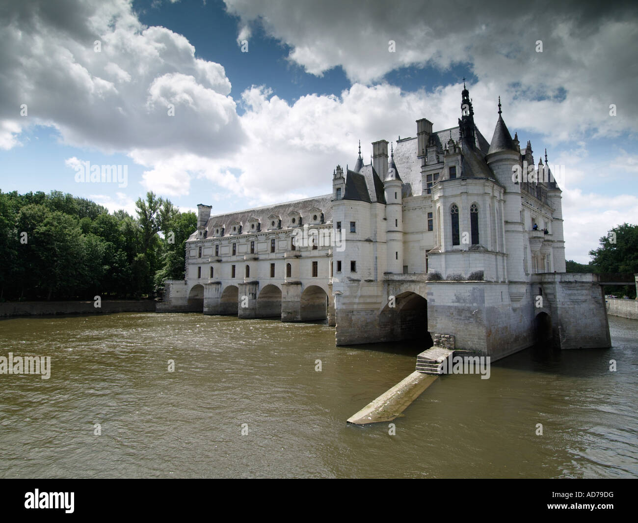 The famous chateau de Chenonceau castle built over the river Cher with ...
