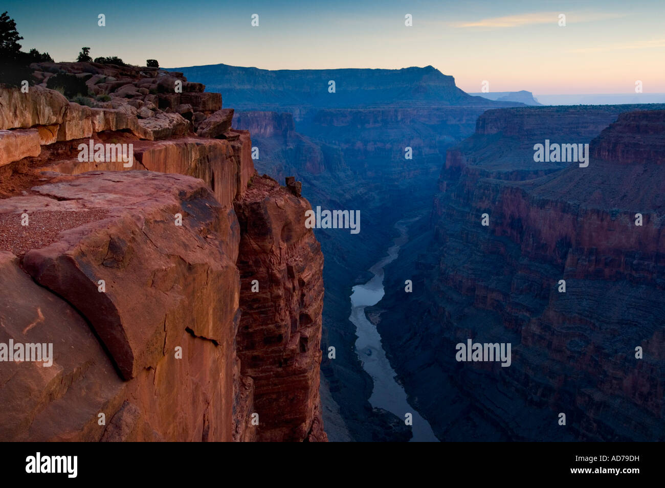 Morning light and steep sheer cliff above the Colorado River Toroweap ...