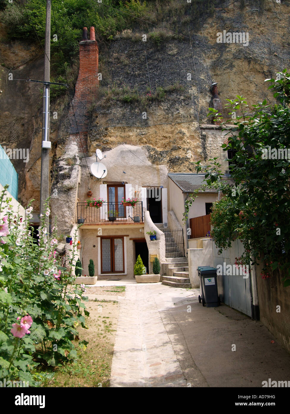 Very old house built into a cave complete with balcony brick chimney ...