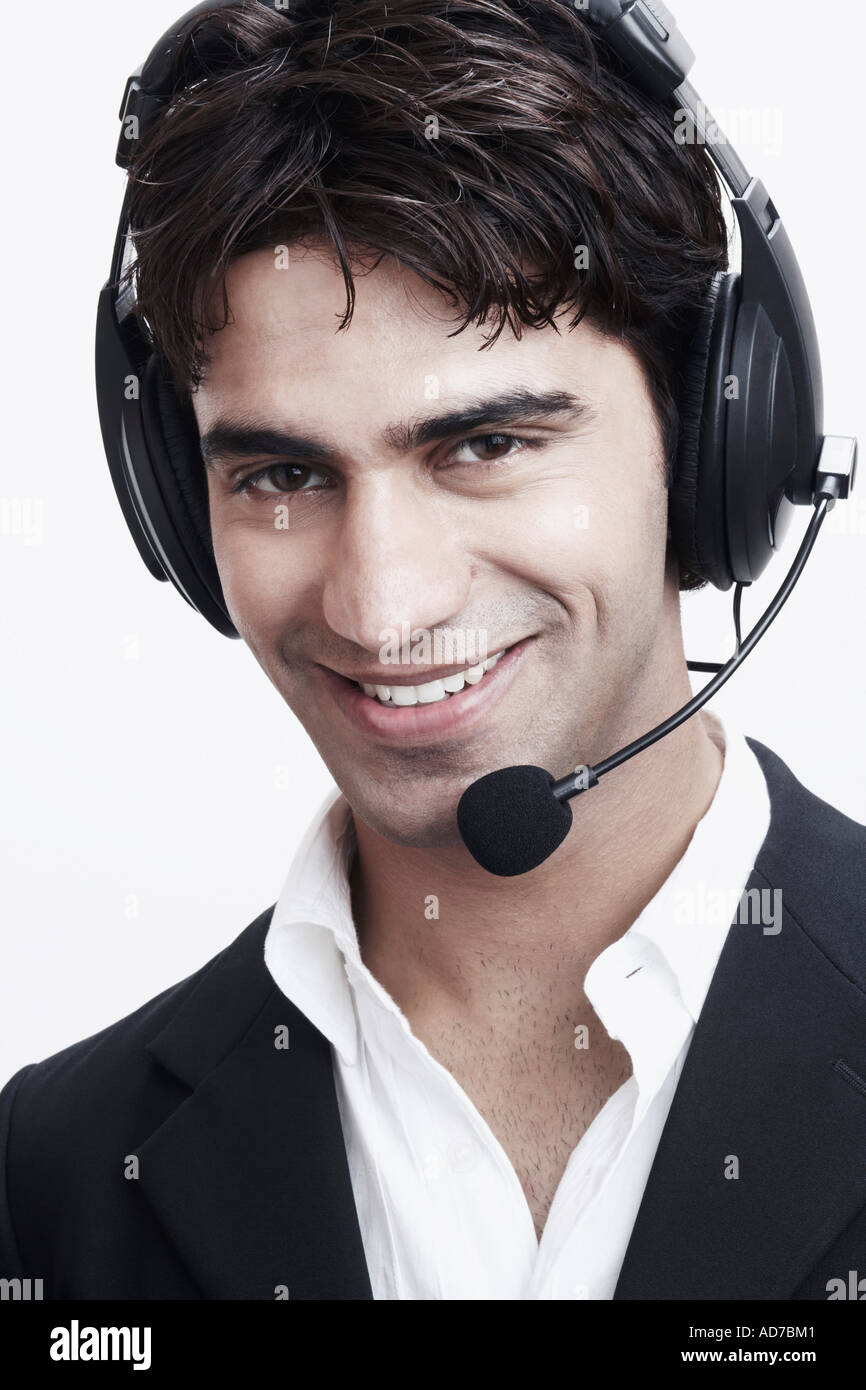 Portrait of a young man wearing a headset Stock Photo - Alamy