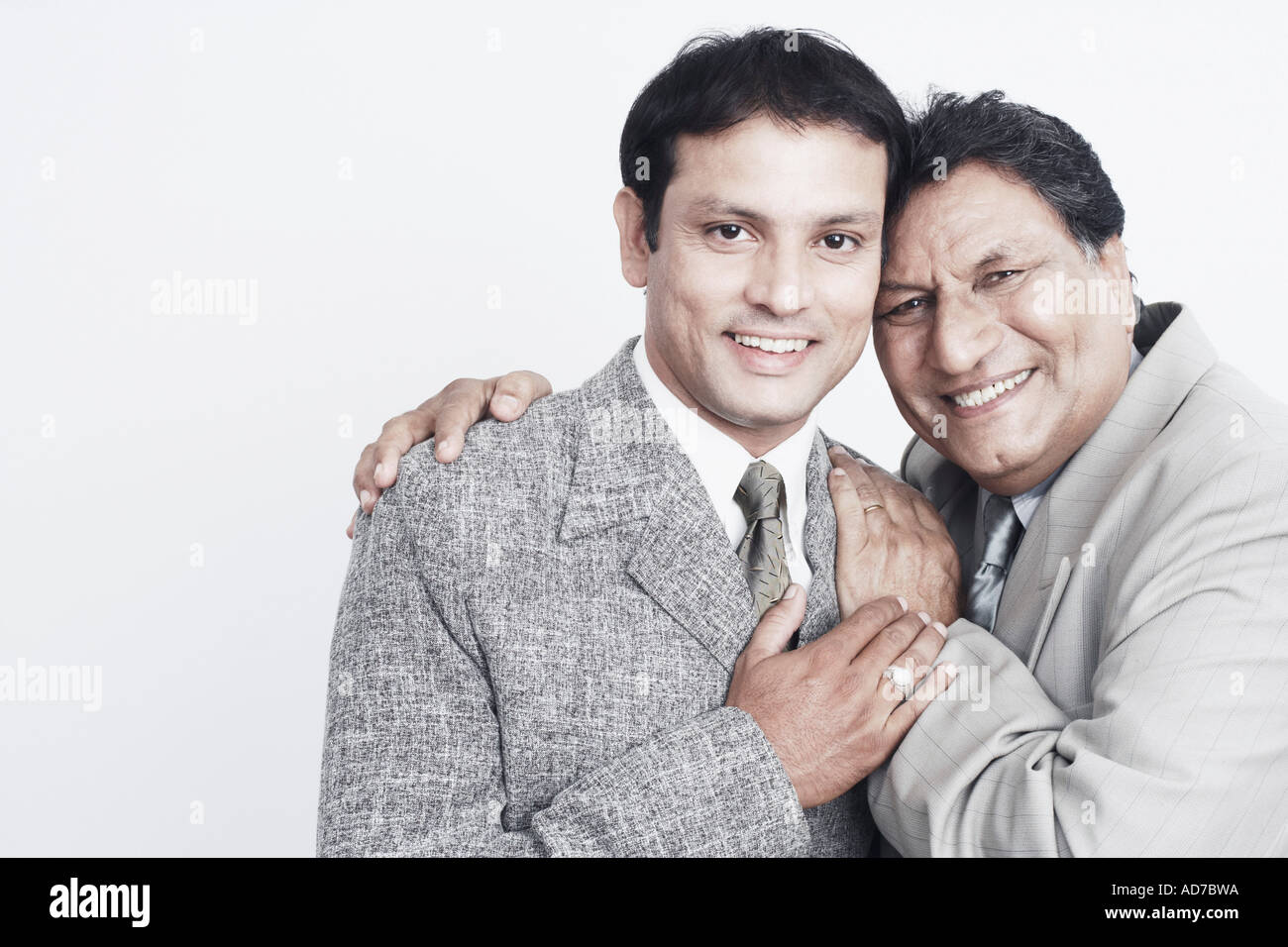 Portrait of a father and his son smiling Stock Photo - Alamy