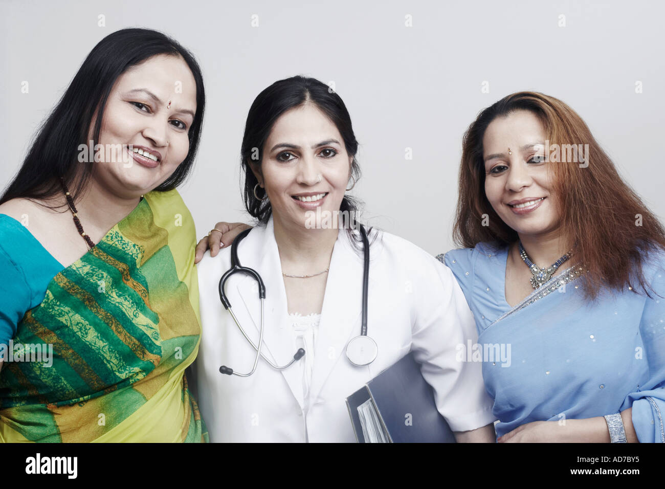 Portrait of three women smiling Stock Photo - Alamy