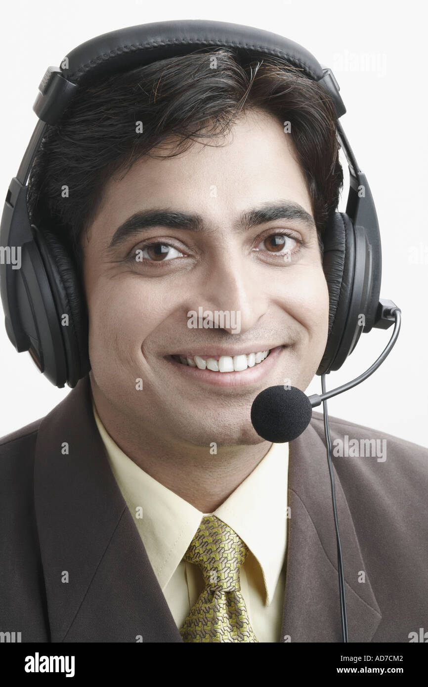 Mid adult man wearing headset hi-res stock photography and images - Alamy