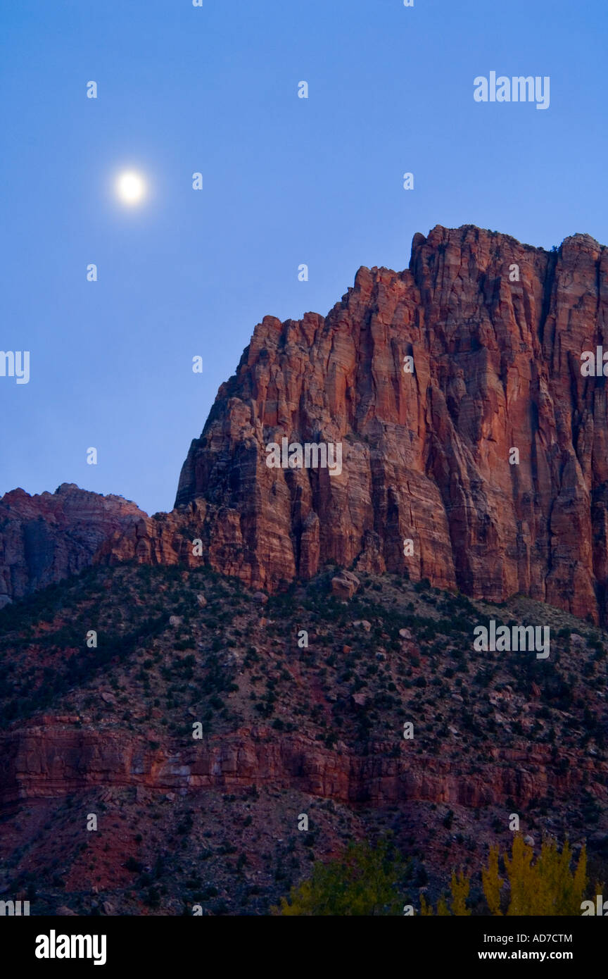 Moonrise in evening light over the cliffs of Johnson Mountain ...
