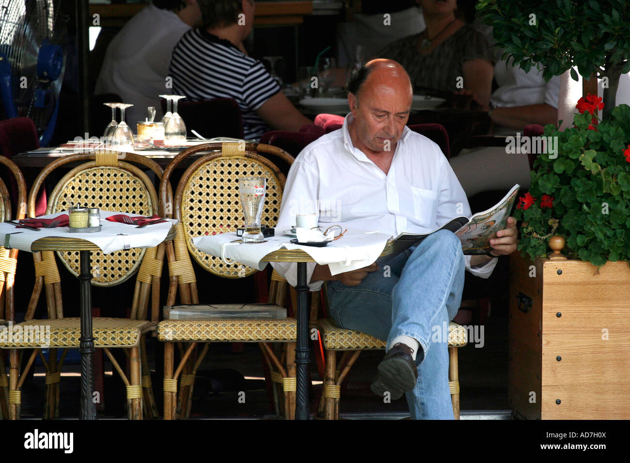 Man sitting outside at Cafe in Paris, France Stock Photo - Alamy