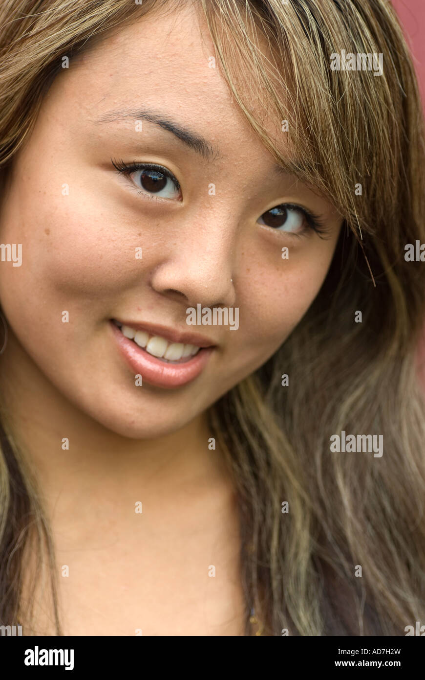 Headshot of a pretty young Asian woman Stock Photo - Alamy