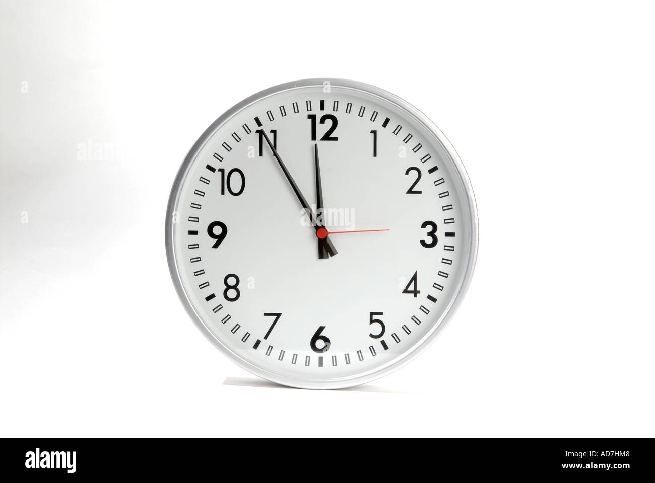 clock is on 5 before 12 Stock Photo - Alamy