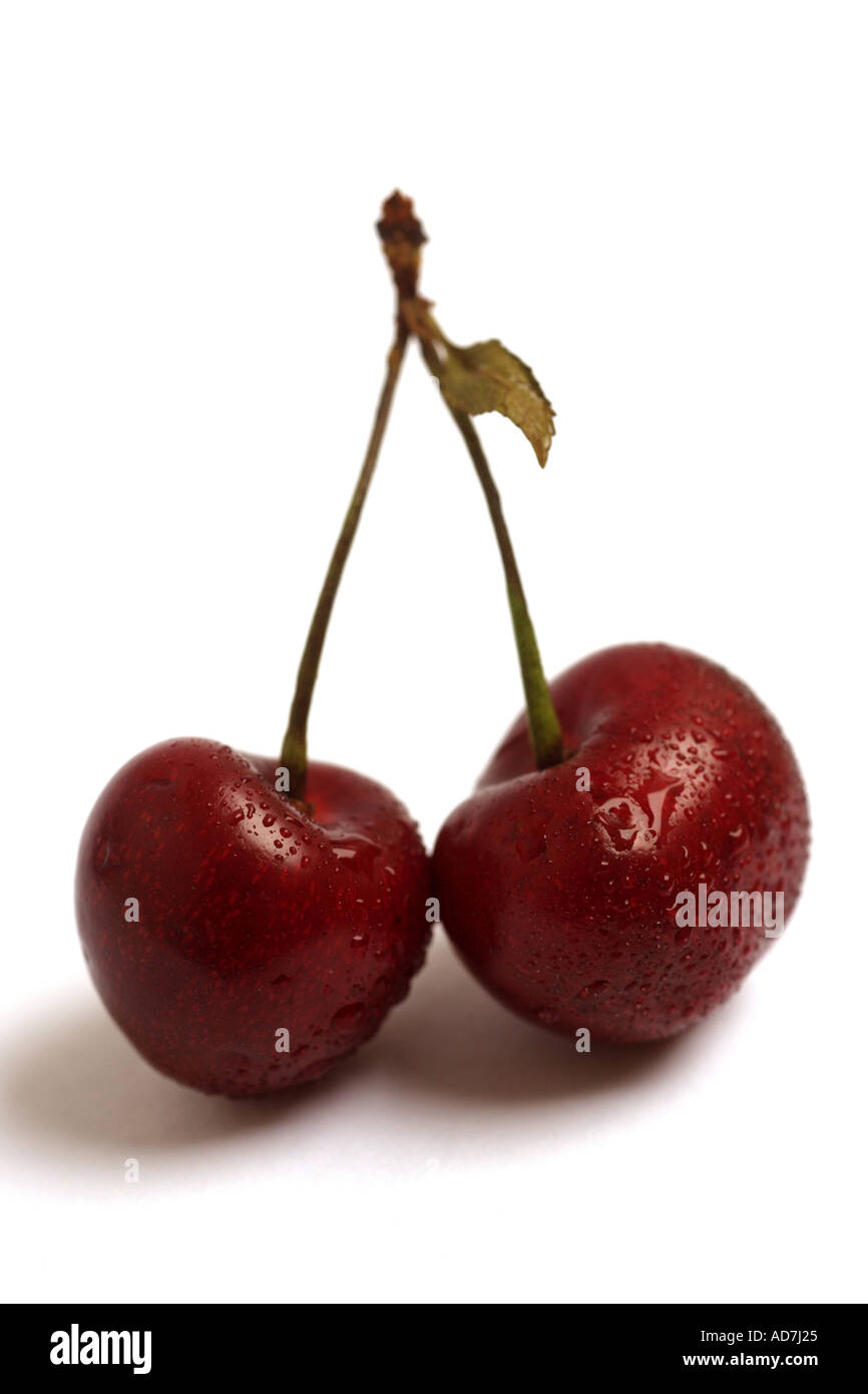Two red cherries close up Stock Photo - Alamy