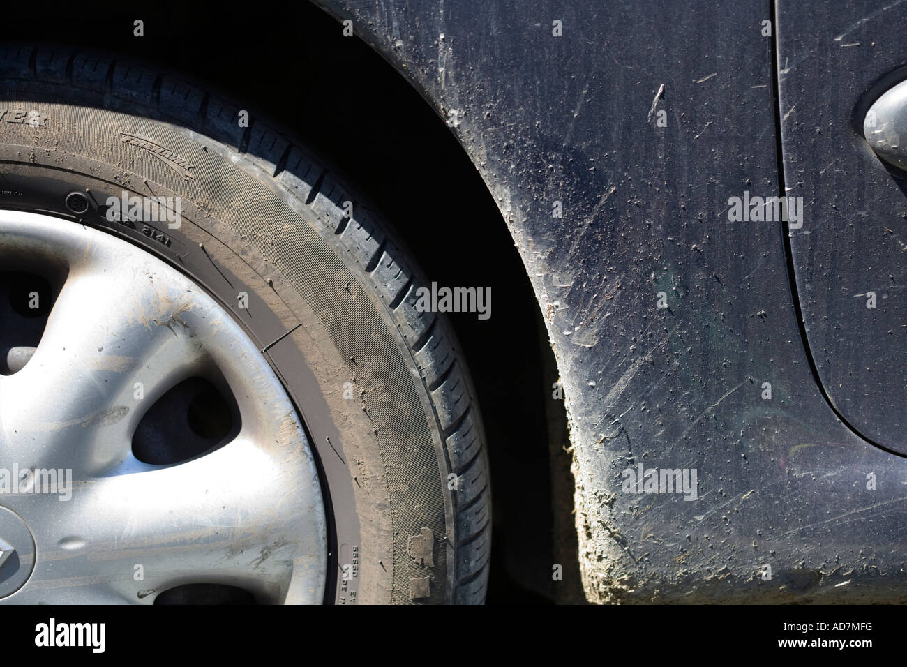 Car wheel and mud splashes on wheelarch Stock Photo - Alamy