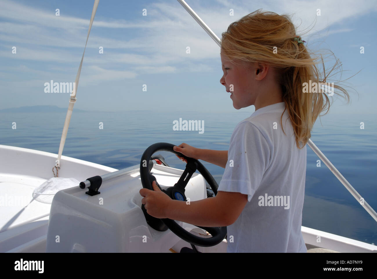 Lucy profile driving speedboat Greece Islands Stock Photo - Alamy