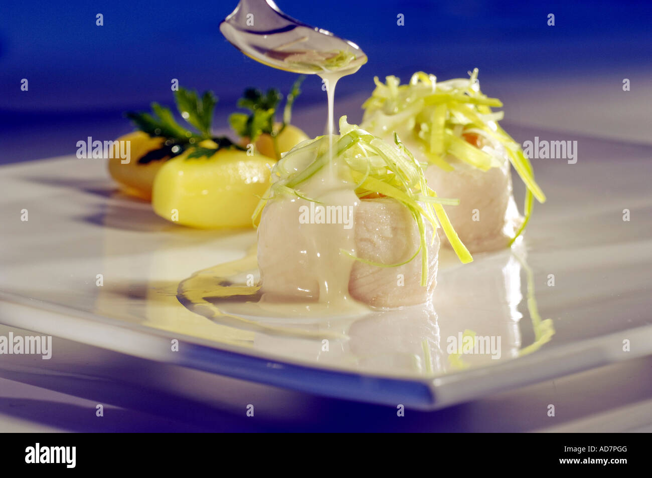 White fish in sauce hi-res stock photography and images - Alamy